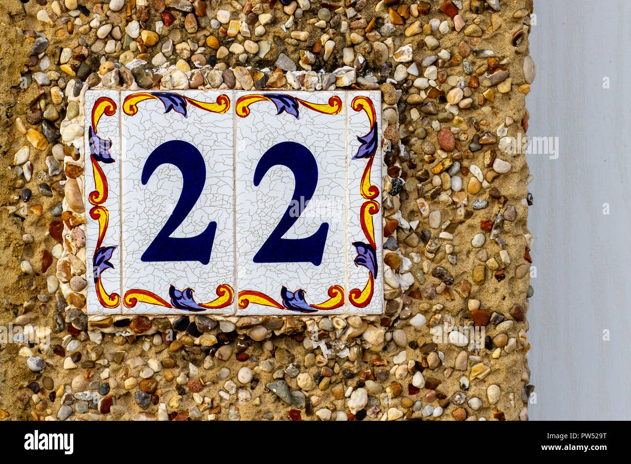 House number 22 with the twenty-two in blue on colourful tiles or ...