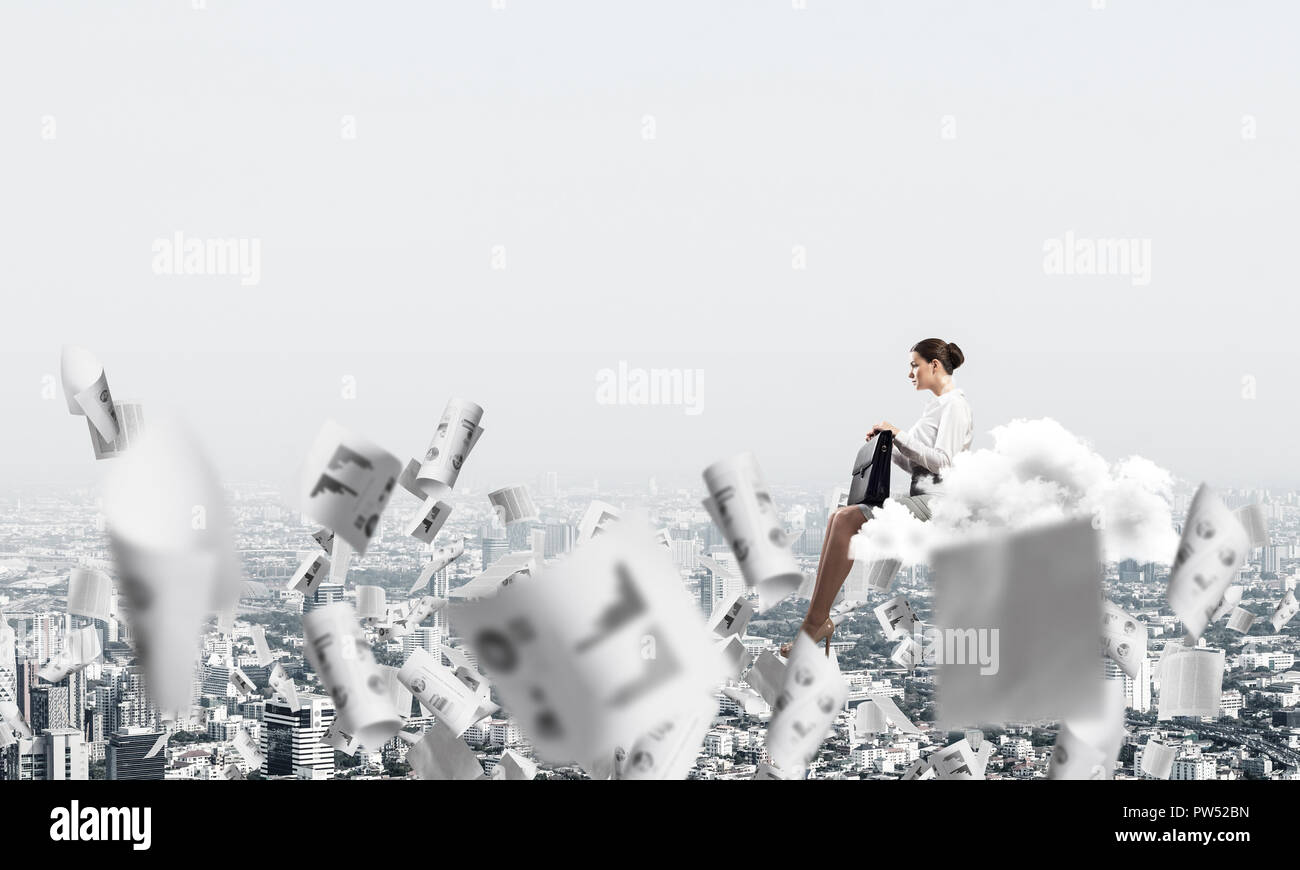 Woman float above city on cloud and papers flying around Stock Photo ...