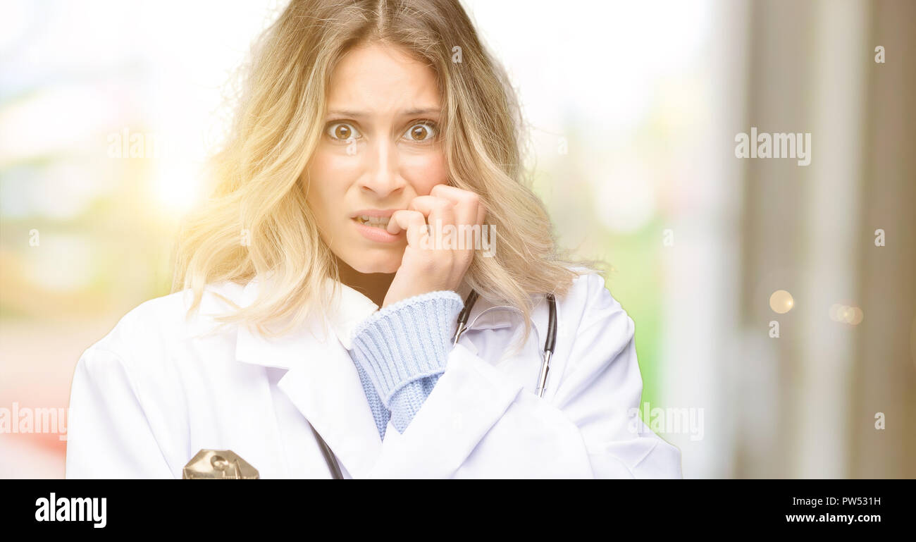 Young doctor woman, medical professional terrified and nervous ...