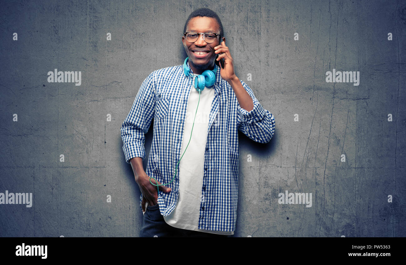 African black man student with smartphone happy talking using a ...