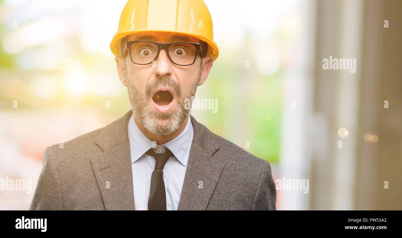 Senior architect or engineer scared in shock, expressing panic and fear ...