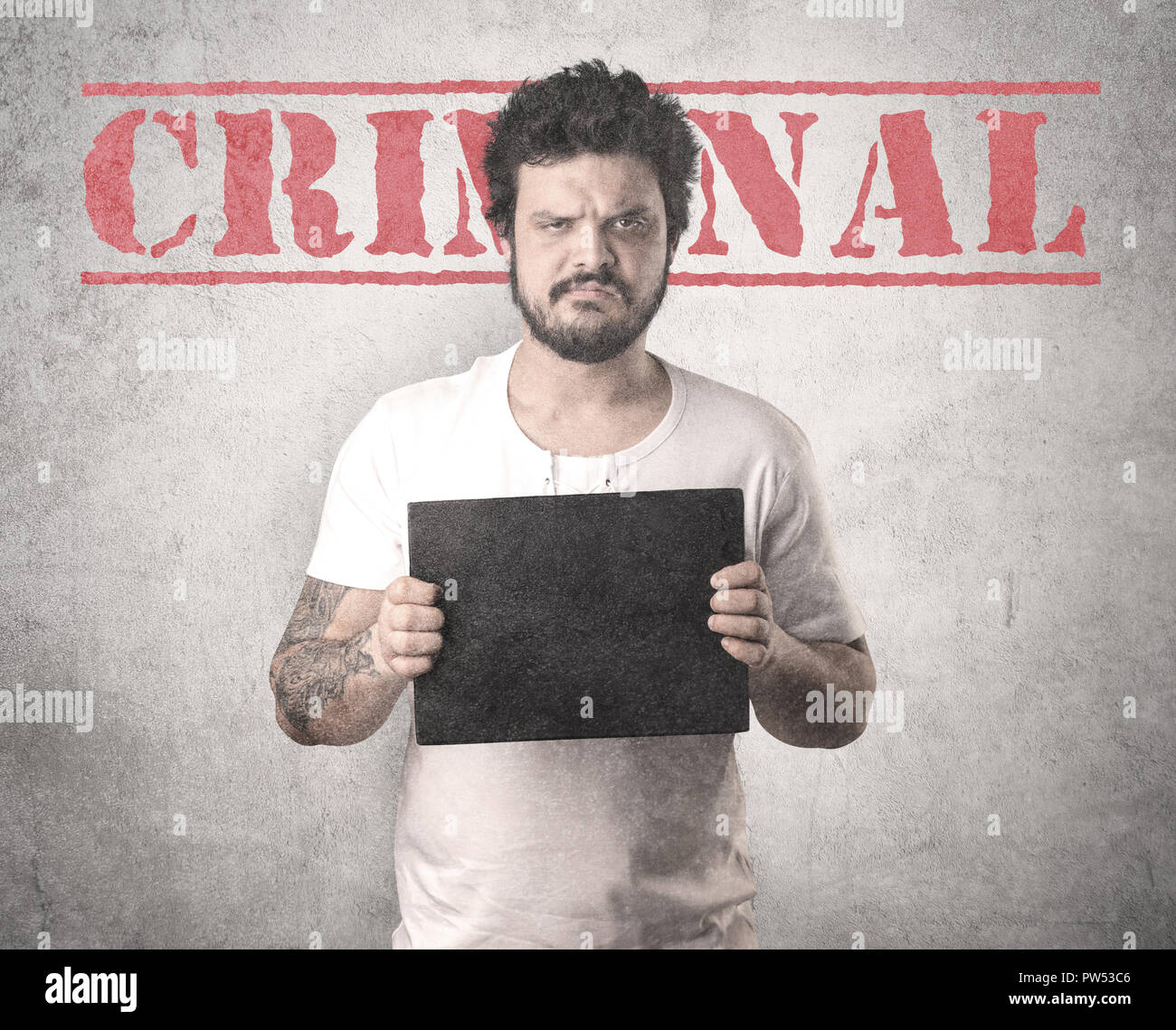 Caught gangster with criminal background Stock Photo - Alamy