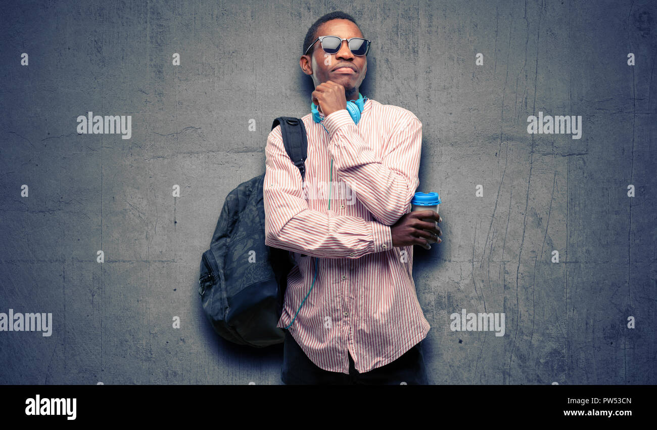 African black man student thinking and looking up expressing doubt and ...