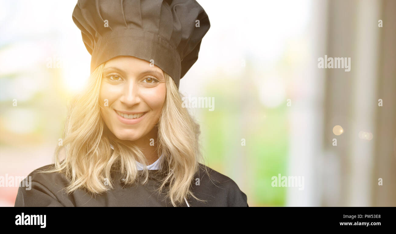 Beautiful cook woman chef holds hands welcoming in handshake pose ...