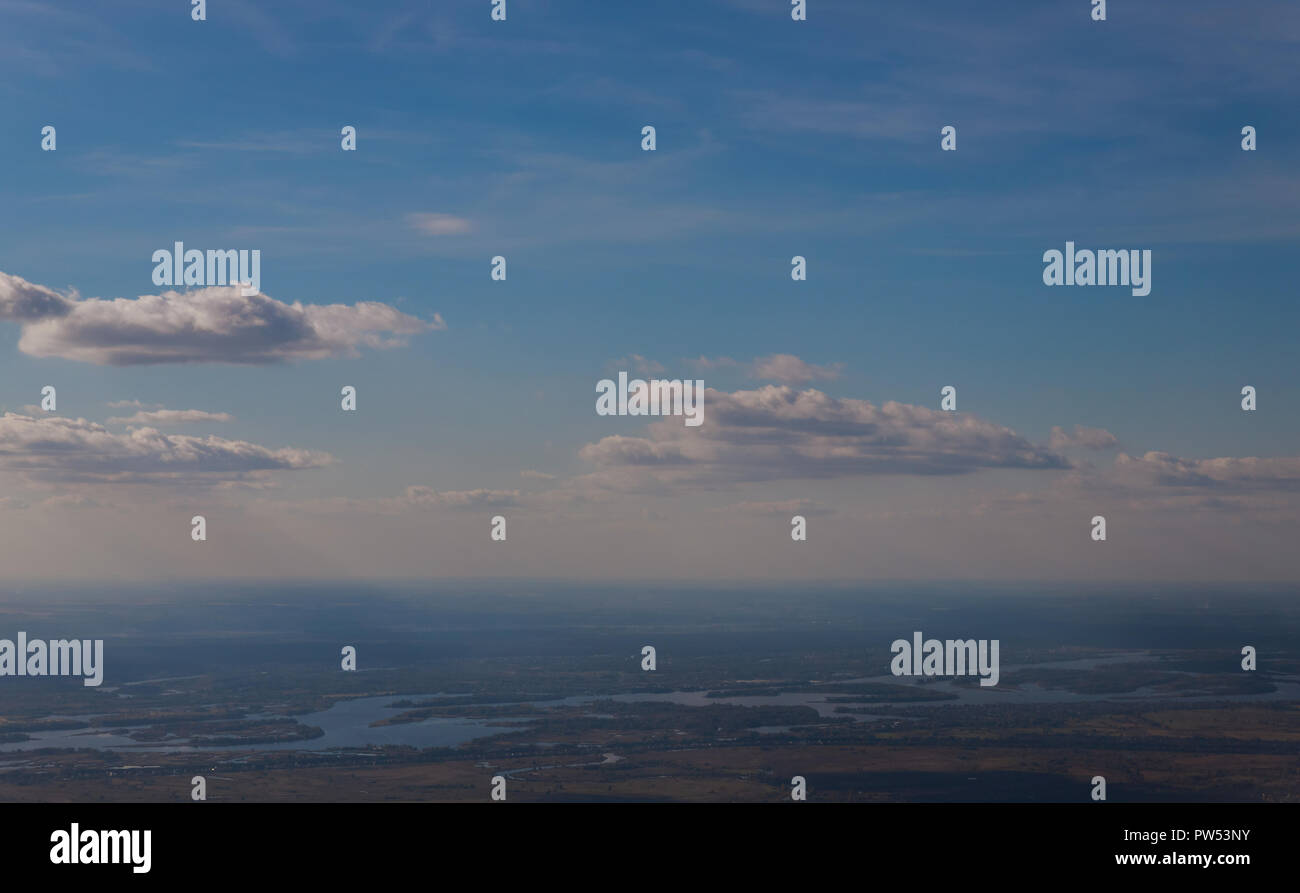The top view from a window of the flying plane on the city from ...