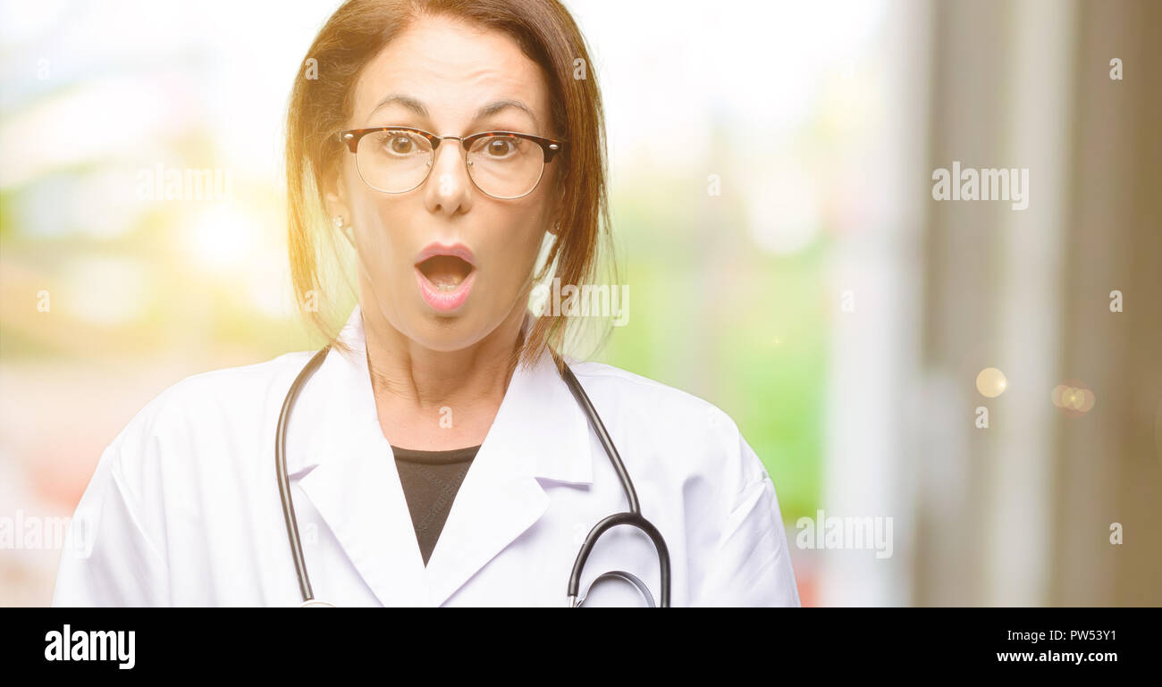 Doctor woman, medical professional scared in shock, expressing panic ...