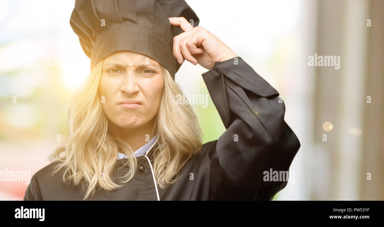 Beautiful cook woman chef doubt expression, confuse and wonder concept ...