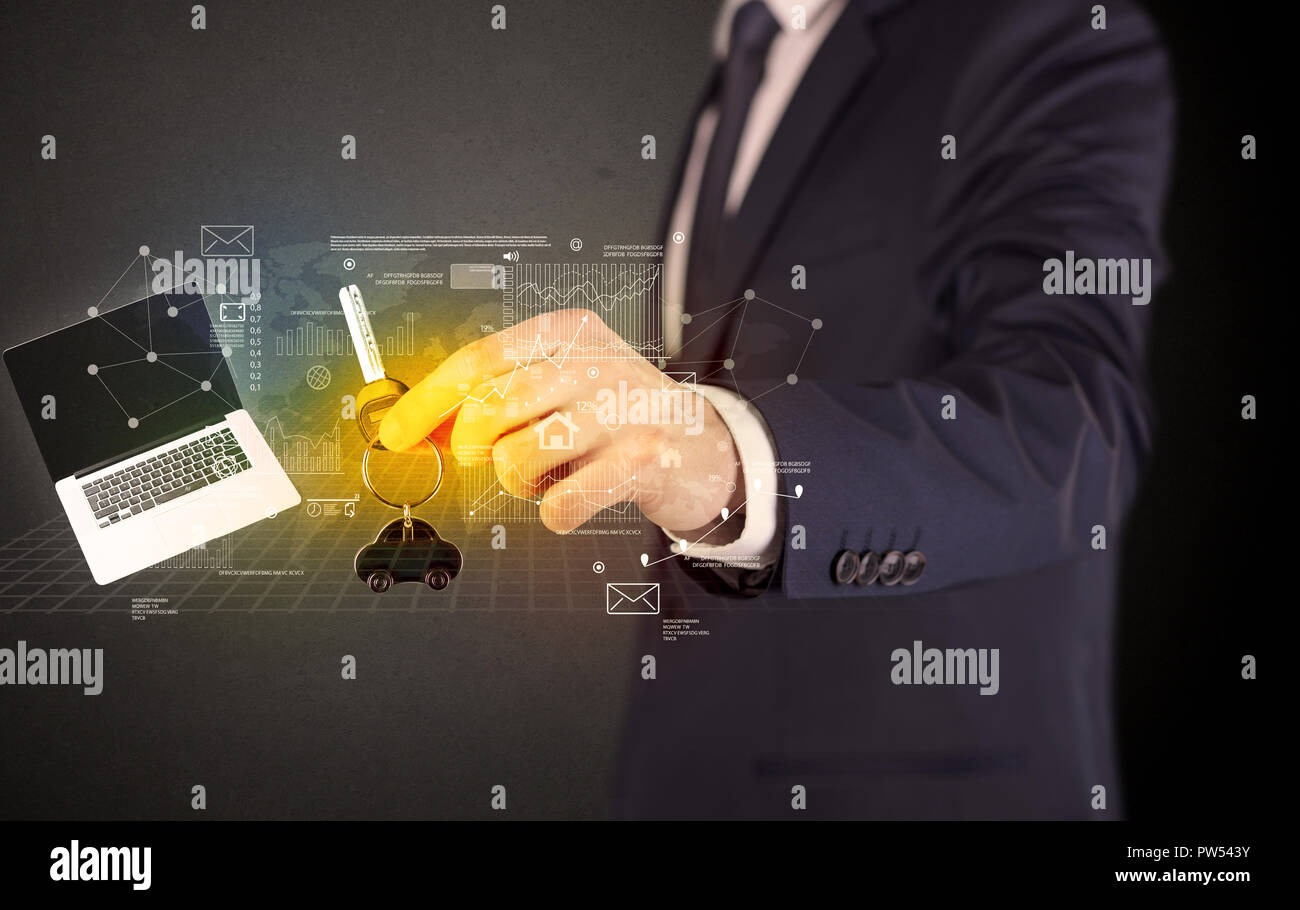 Businessman in suit holding keys with statistics, graphs and icons ...