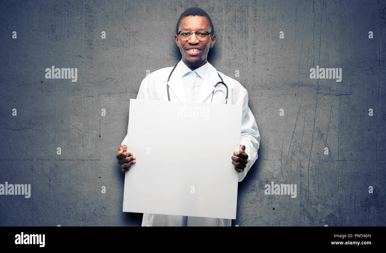 Young black doctor, medical professional holding blank advertising ...