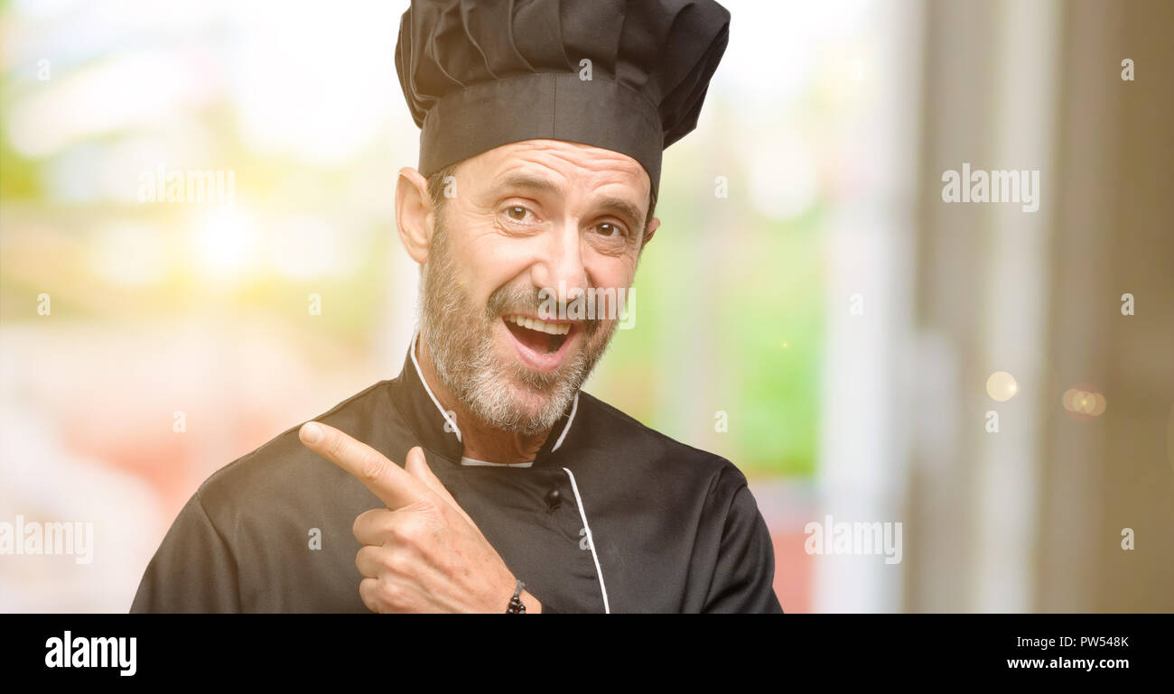 Standing pointing smiling uniform hat hi-res stock photography and ...