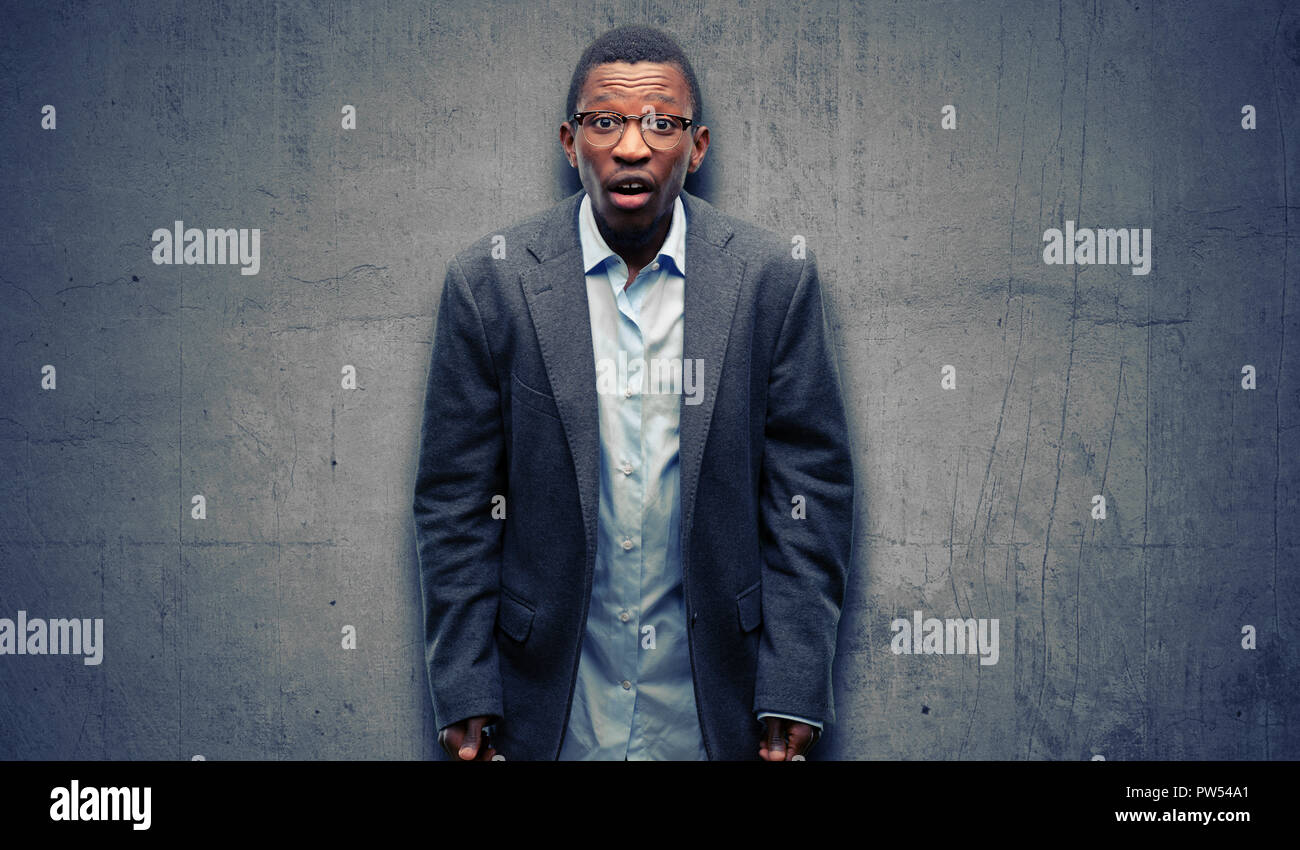 African black man wearing jacket scared in shock, expressing panic and ...