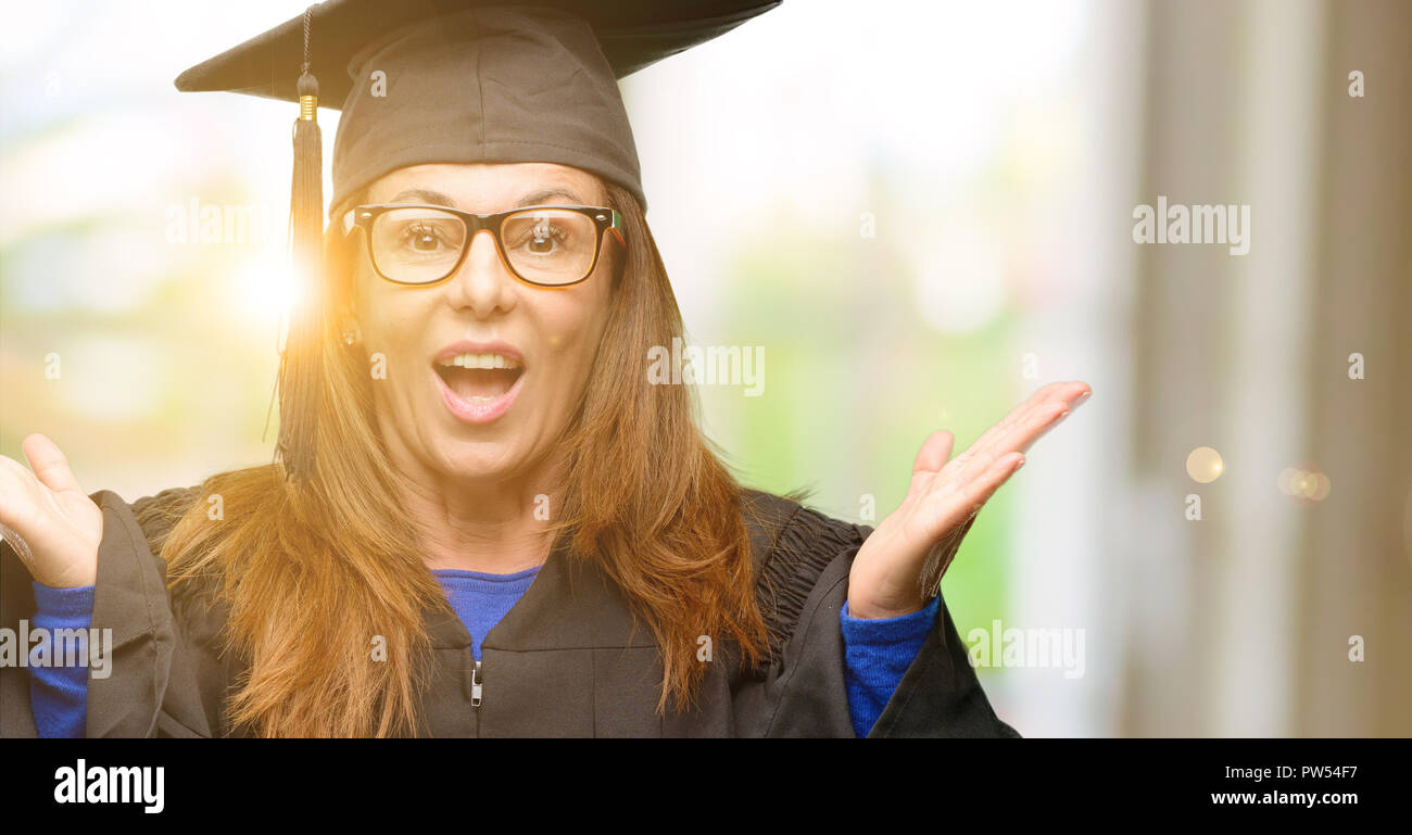 Senior graduate student woman happy and surprised cheering expressing ...