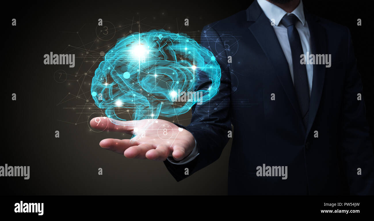Businessman holding human brain on his hand with logistics symbols ...
