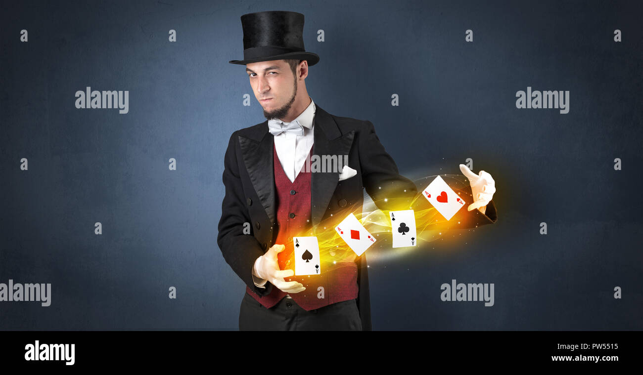 Illusionist in tails bandy play cards between his two hands Stock Photo ...