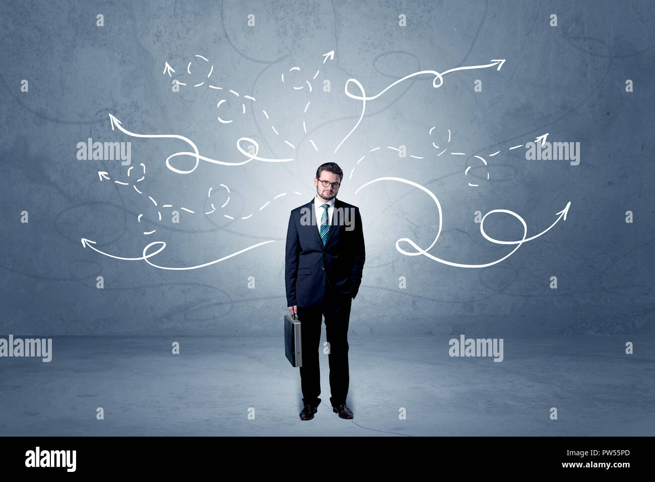 Confused young businessman choosing between hi-res stock photography ...