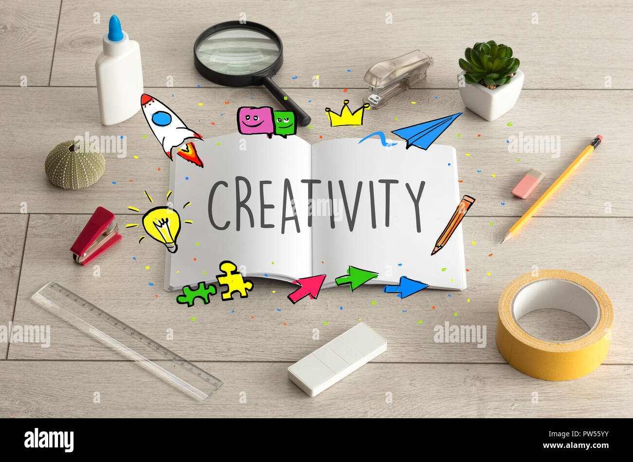 Open notebook on the floor with instruments on the floor and creativity ...