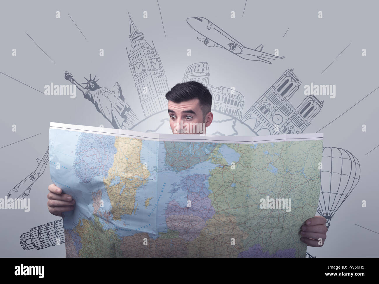 Handsome young man holding a map with famous sightseeing destinations ...
