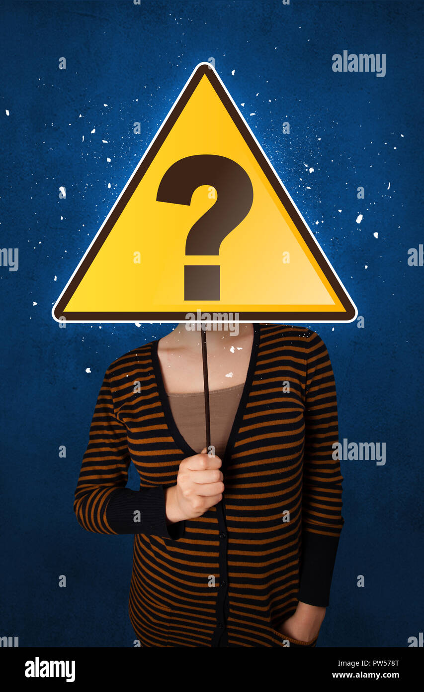 Casual young woman holding yellow sign with question mark Stock Photo ...