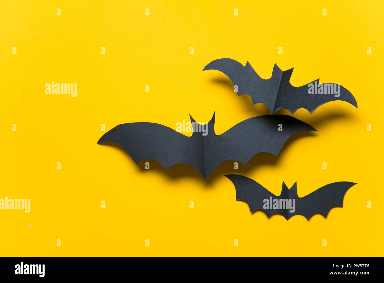Halloween paper vampire bat decorations on an orange background Stock ...