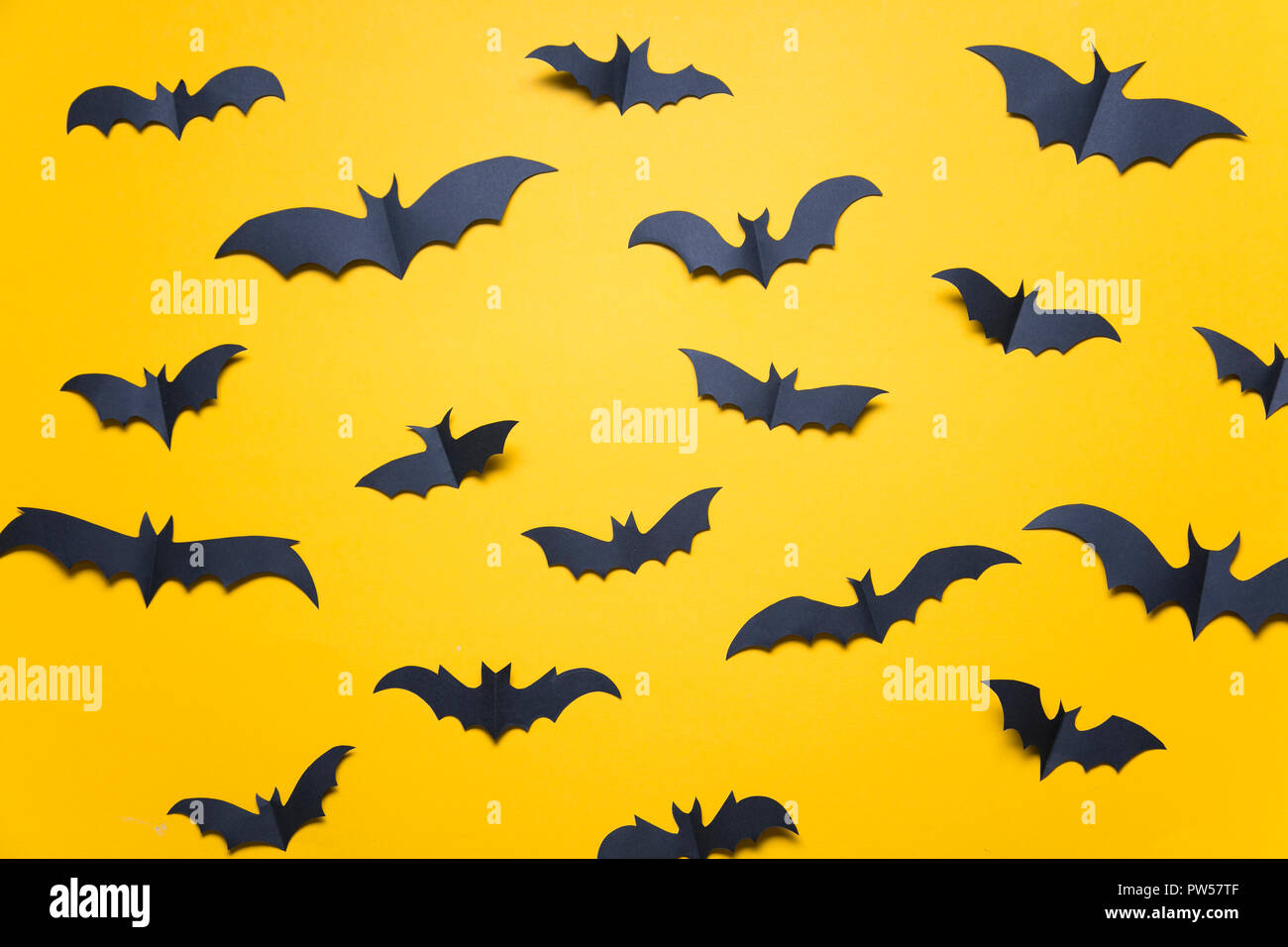Halloween paper vampire bat decorations on an orange background Stock ...