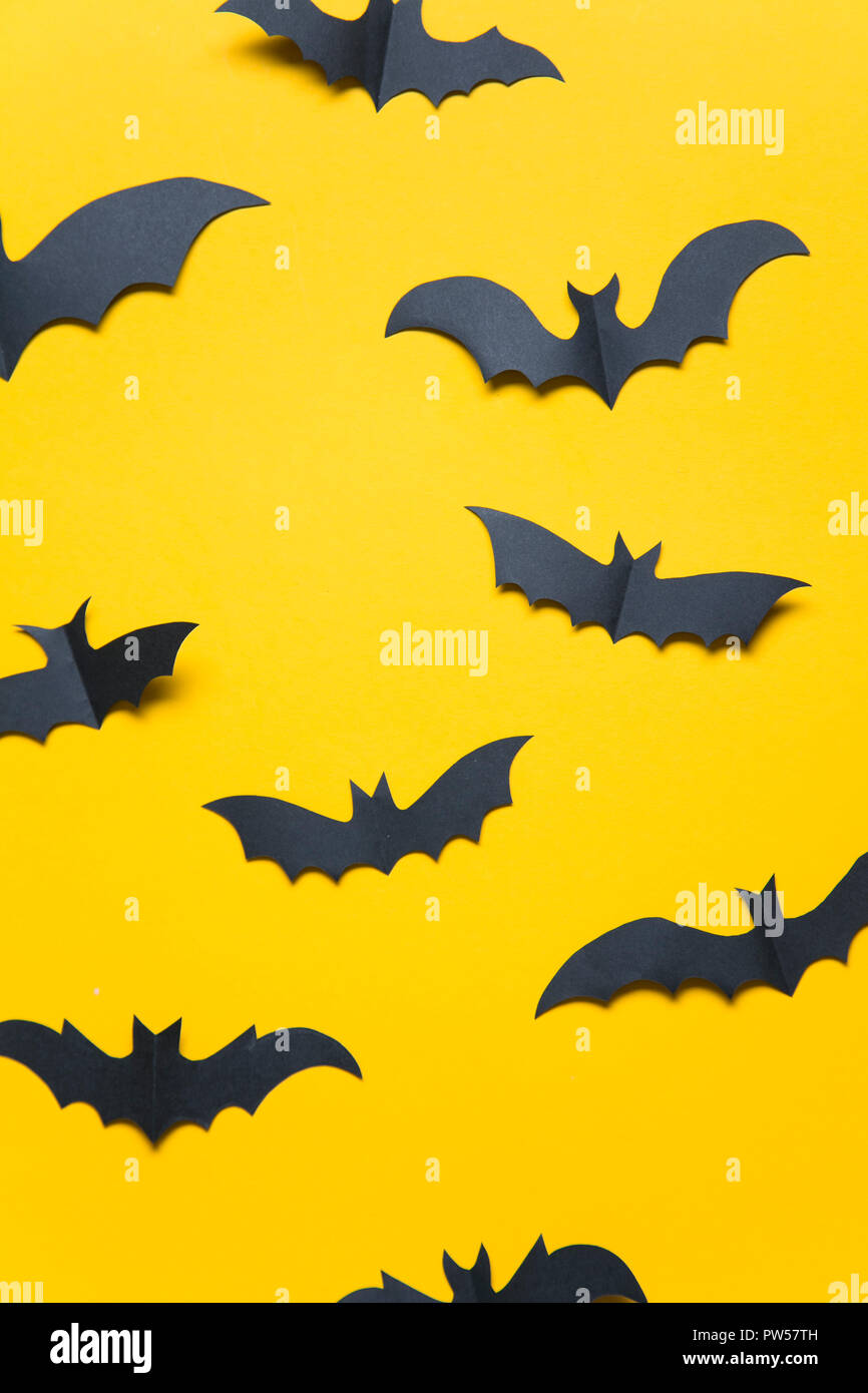 Halloween paper vampire bat decorations on an orange background Stock ...