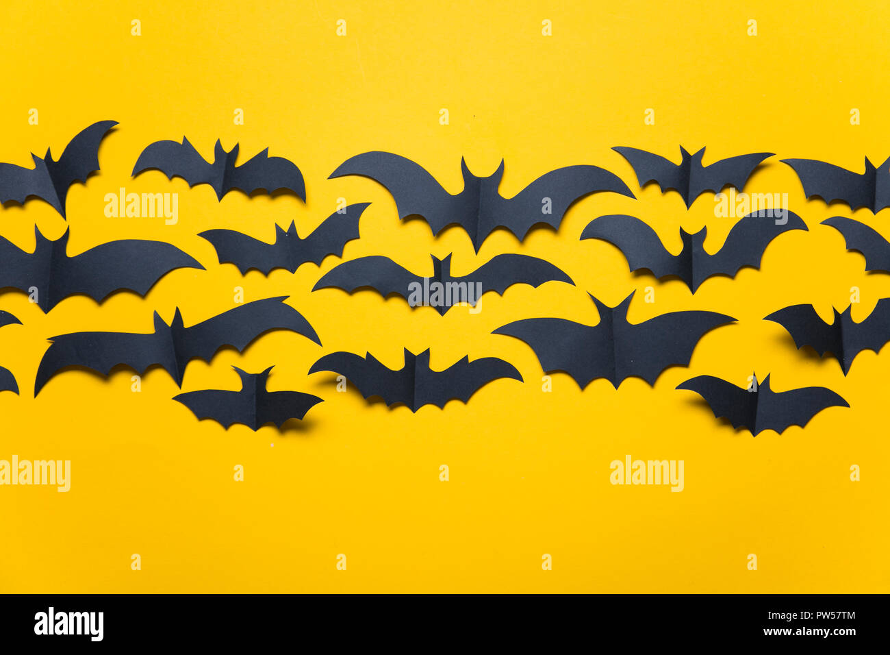 Halloween paper vampire bat decorations on an orange background Stock ...