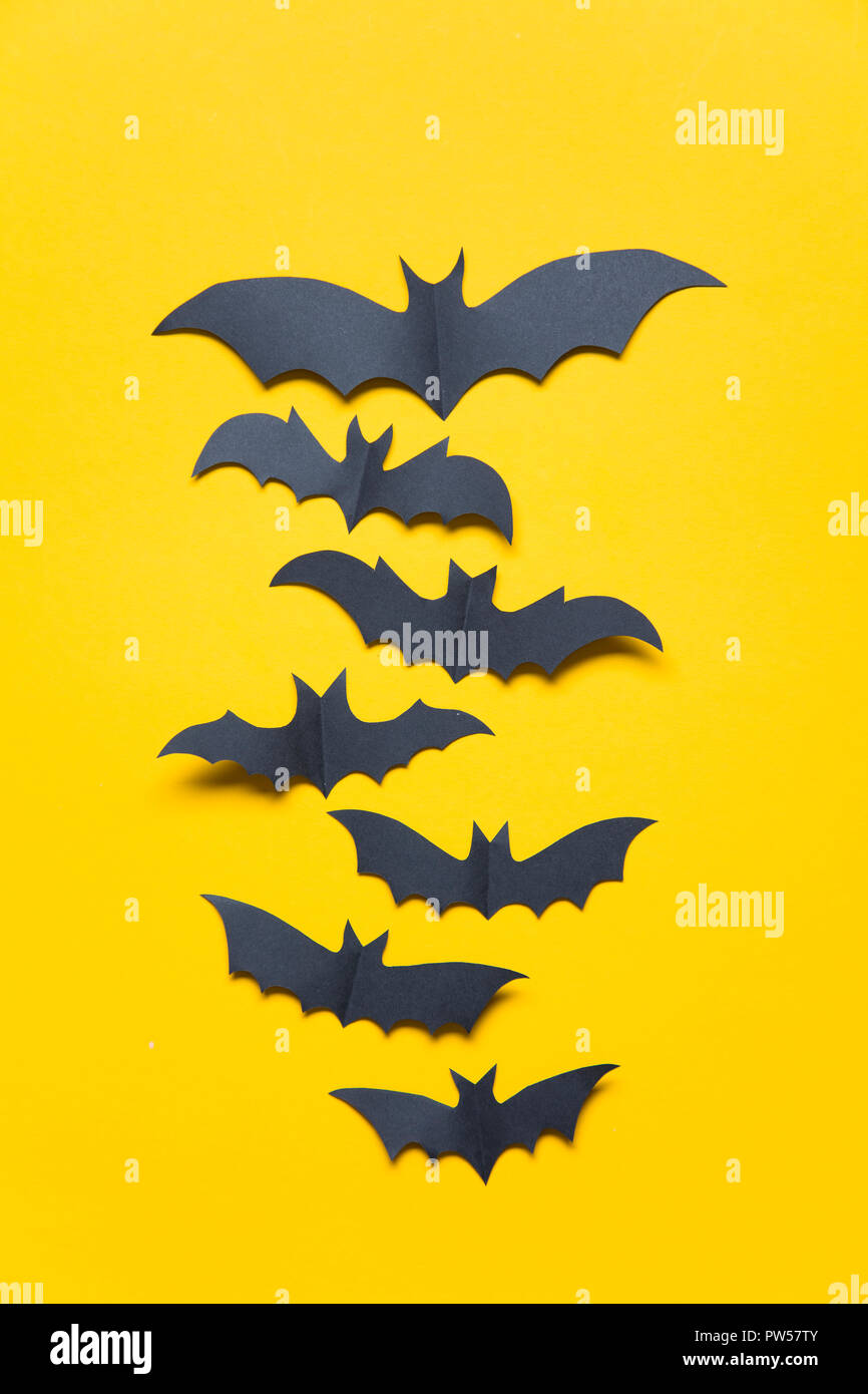 Halloween paper vampire bat decorations on an orange background Stock ...