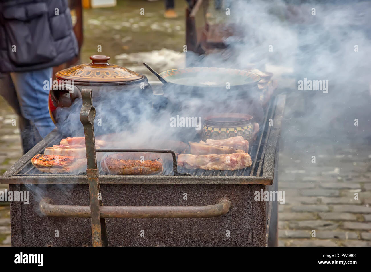 Street food and outdoor cooking concept. Grilled meat street food Stock ...