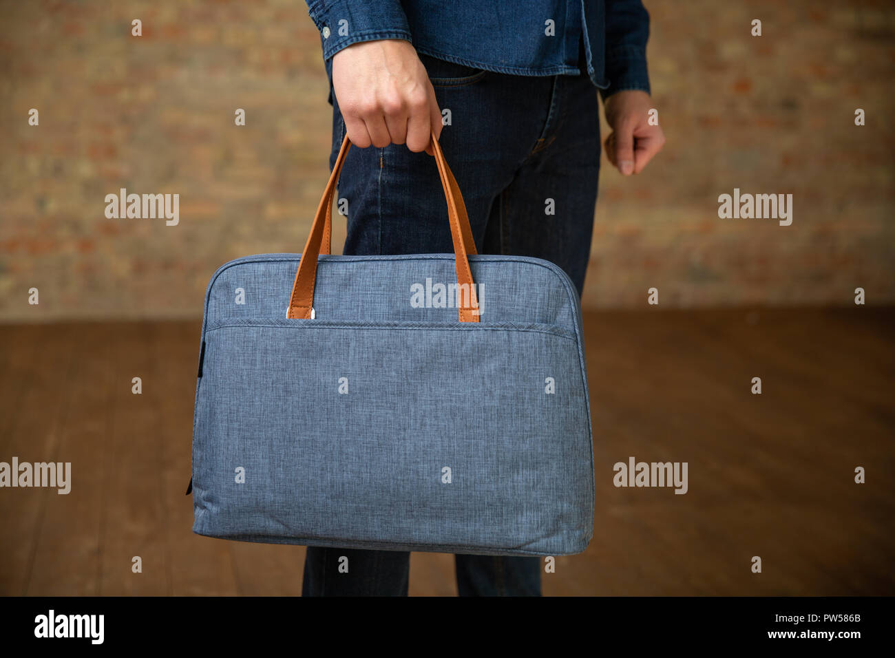 Holding up a brief case hi-res stock photography and images - Alamy