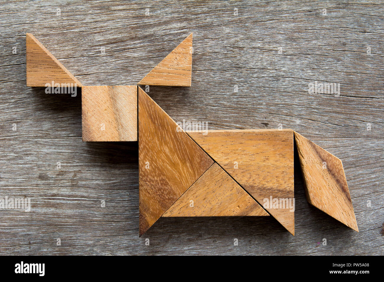 Wooden tangram puzzle in buffalo or bull shape background Stock Photo ...