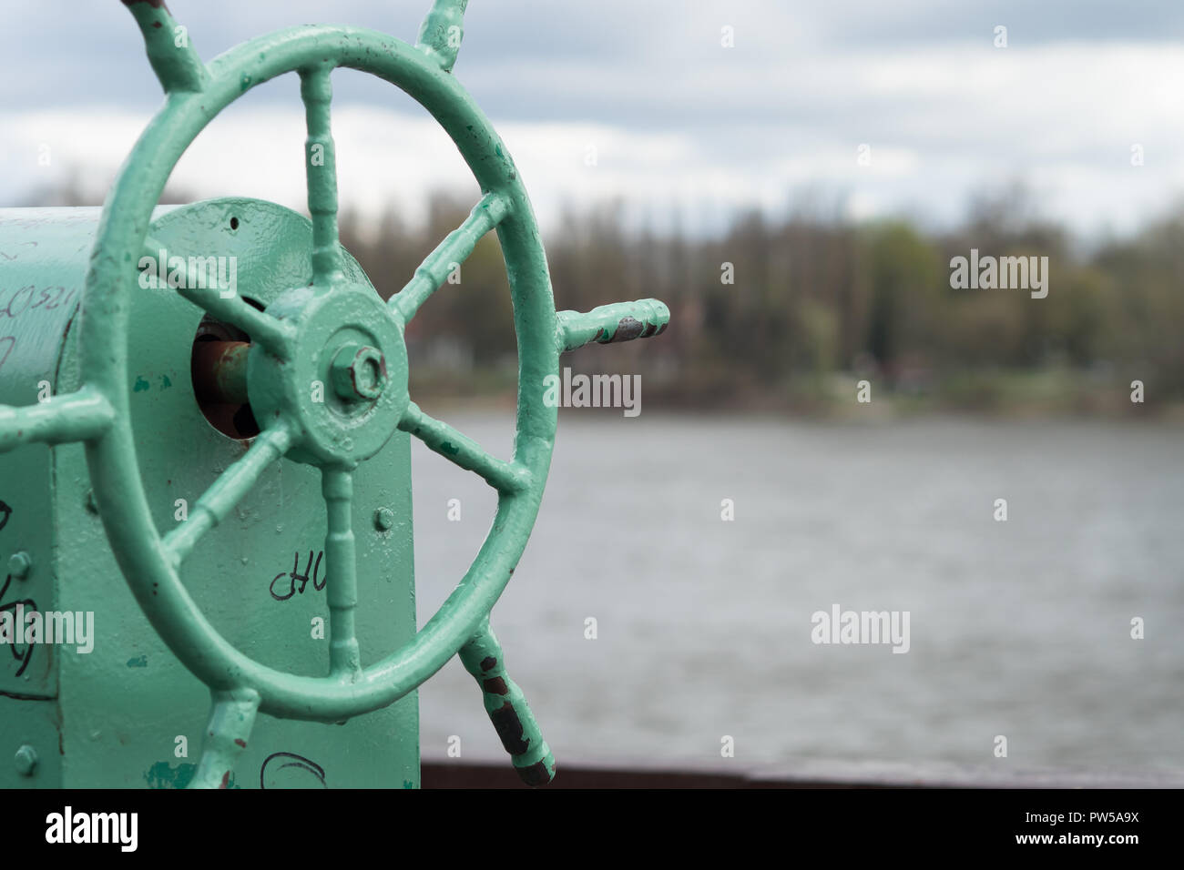 old barge and green hand wheel Stock Photo - Alamy