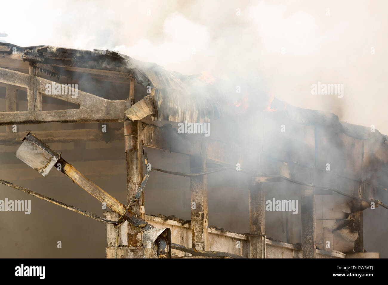 Fire disaster in a warehouse. Fire fighting in an industrial area Stock ...