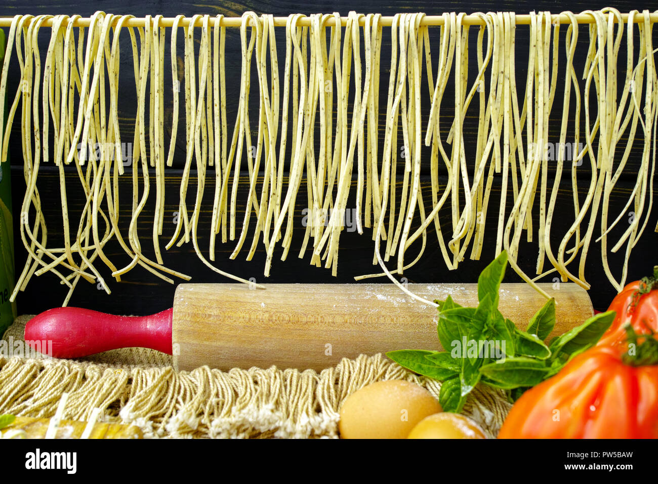 Making spaghetti with fresh basil, drying of traditional italian ...