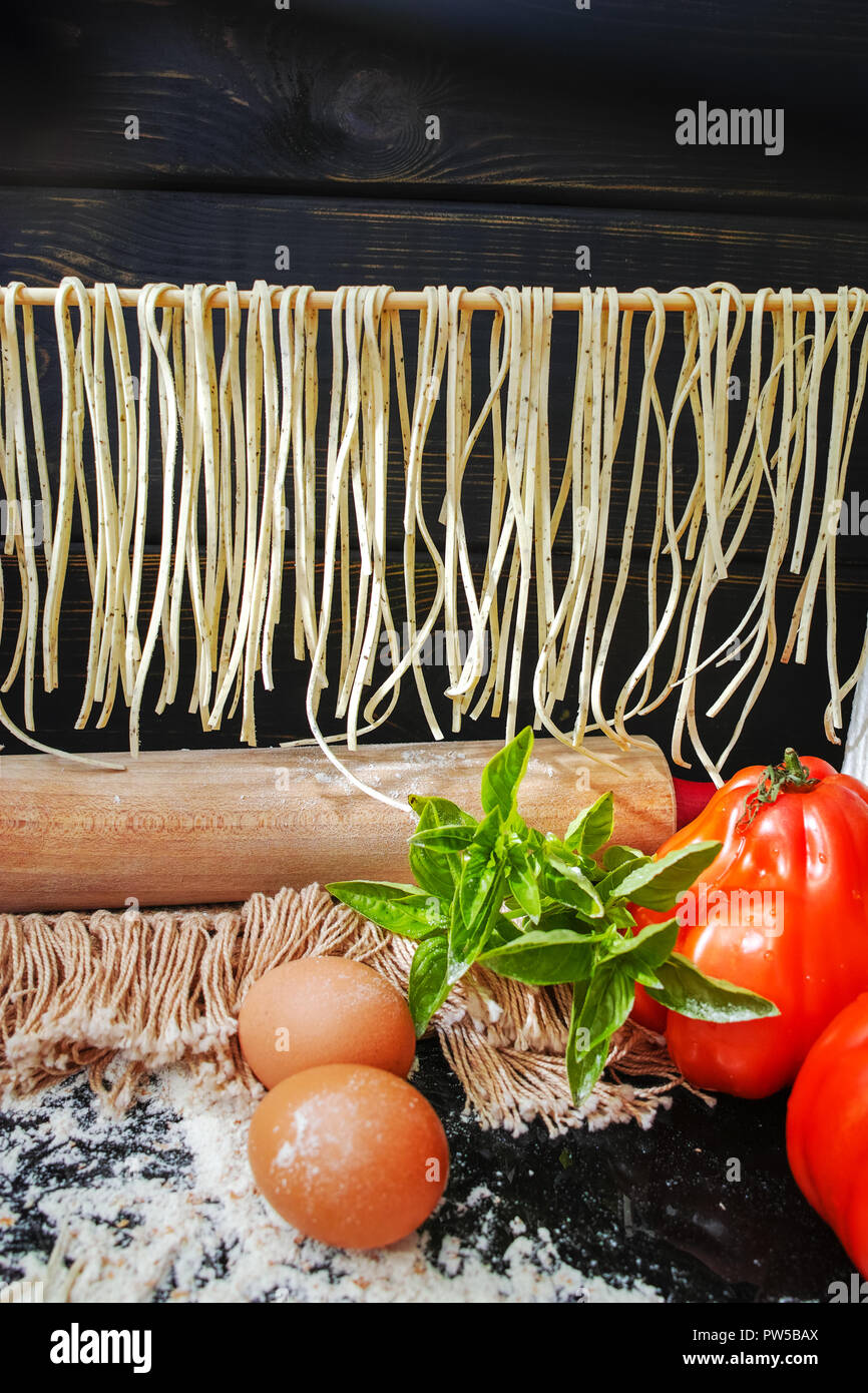 Making spaghetti with fresh basil, drying of traditional italian ...