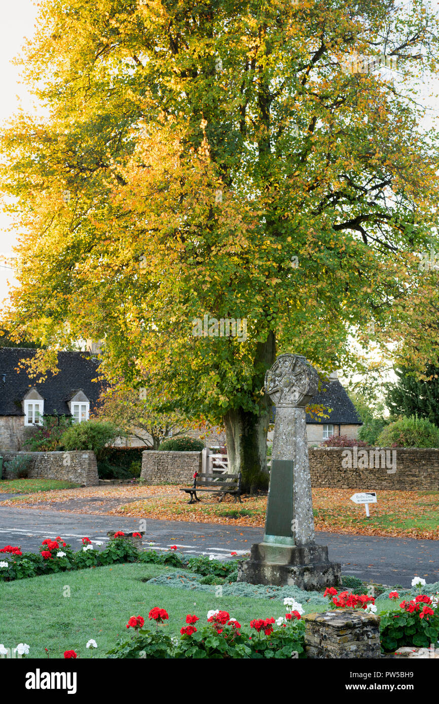 Cotswold stone cottages in the early morning autumn sunlight. Icomb ...