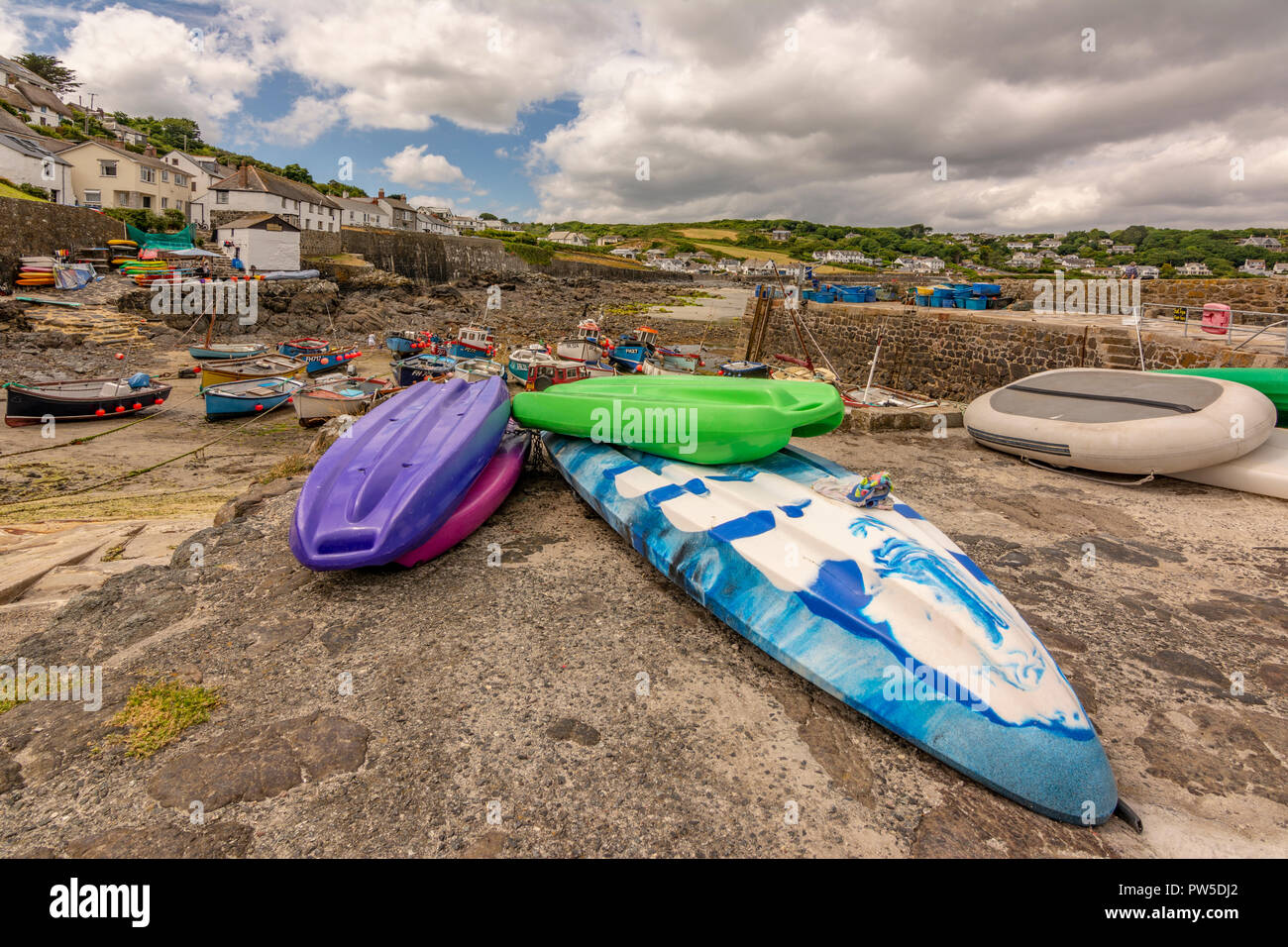 Surf / water boards - Coverack harbour, Cornwall, UK Stock Photo - Alamy