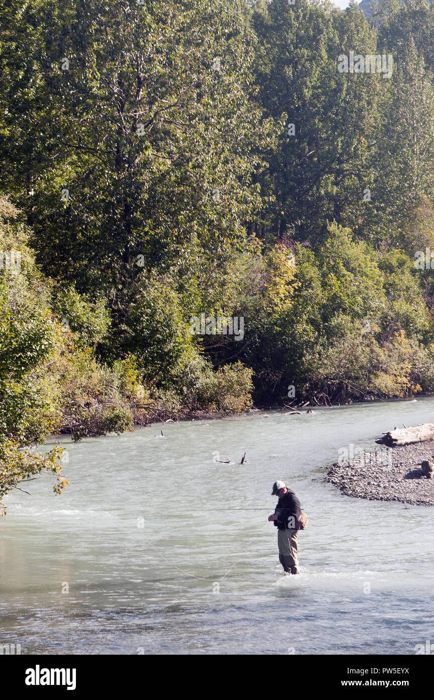Fisherman in Alaskan stream Stock Photo - Alamy