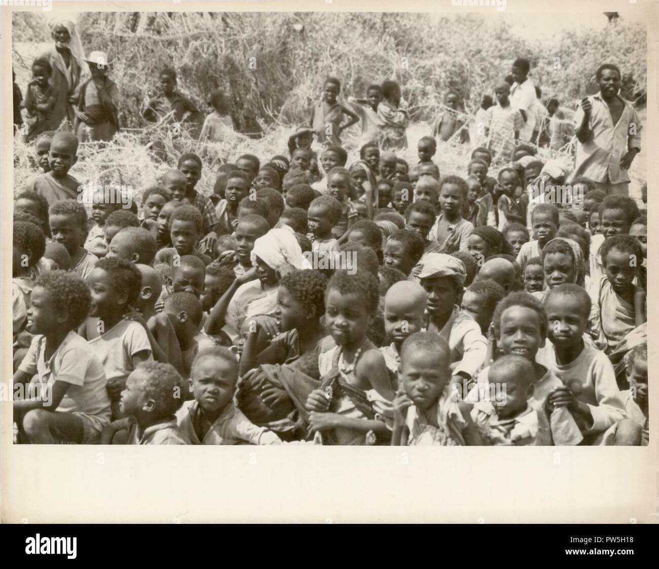 Black and white photo of several village chidren sitting together Stock ...
