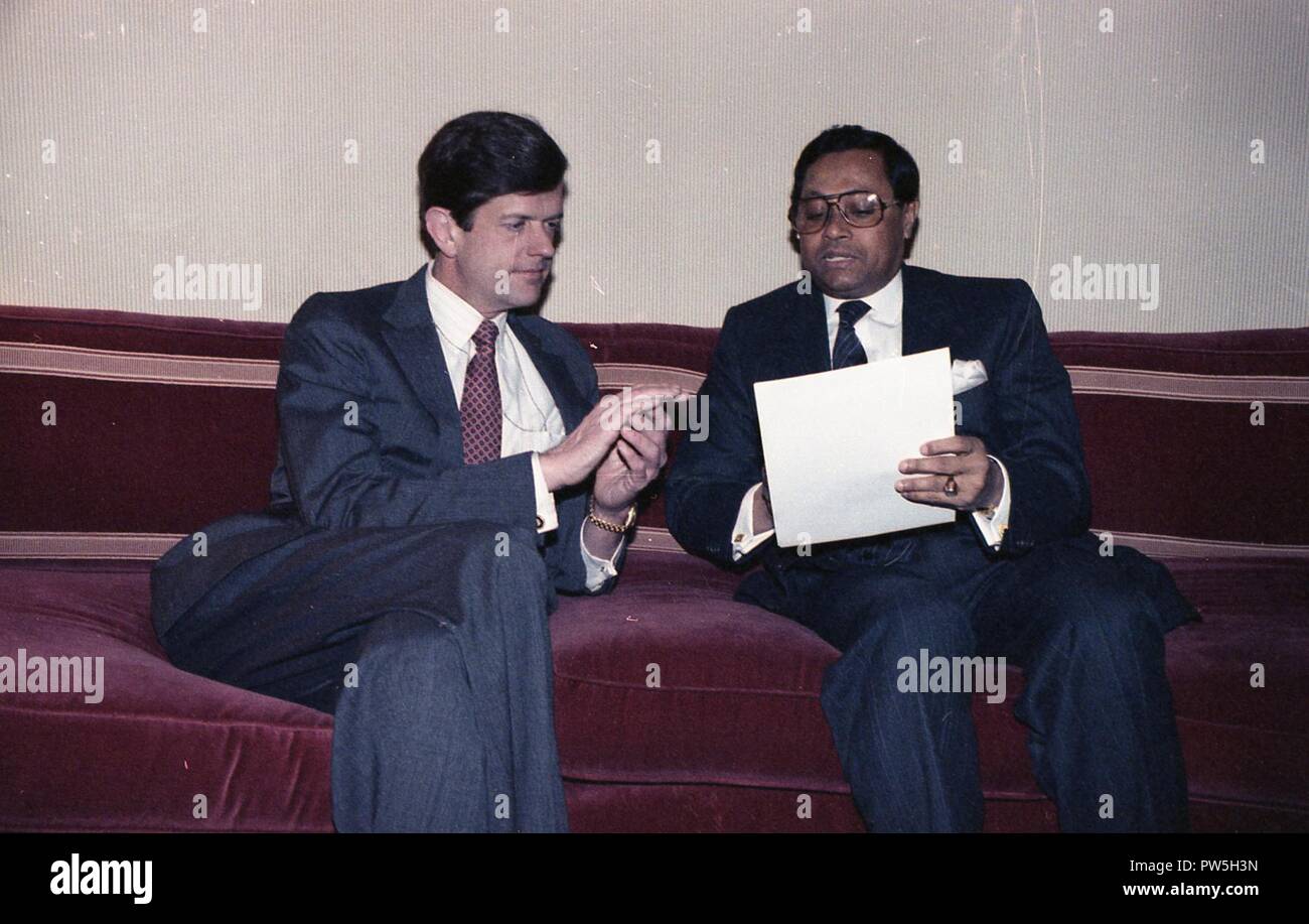 TWO MEN LOOKING OVER SOME PAPERS Stock Photo - Alamy