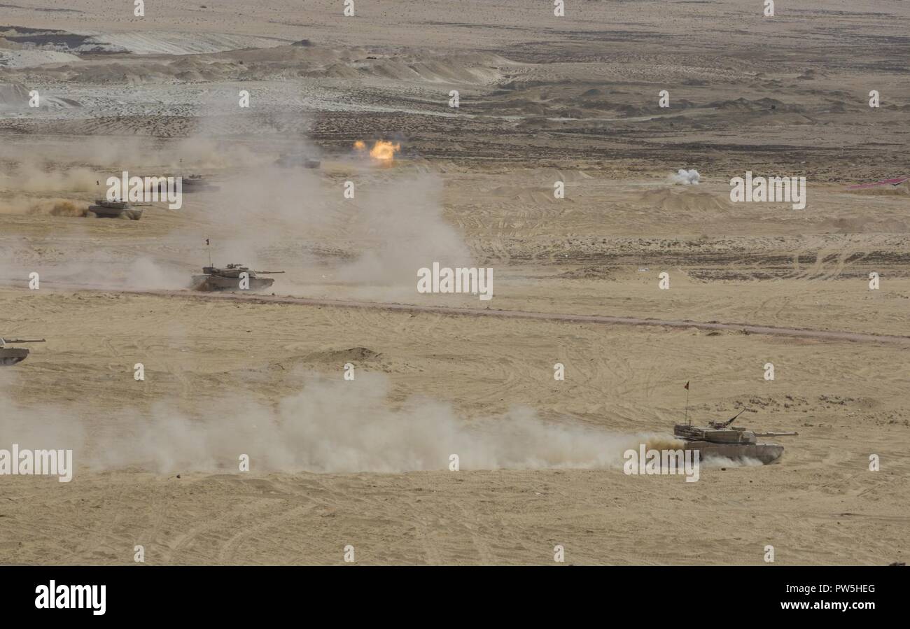 A wave of Egyptian M1A1 Abrams tanks rolls onto a simulated battlefield ...