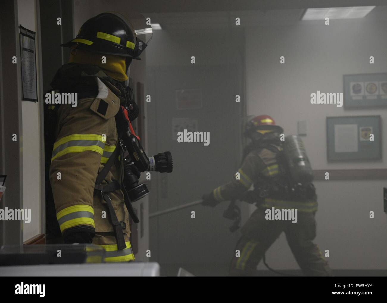 Senior Airman Kristopher Morgan, left, 51st Civil Engineer fire ...