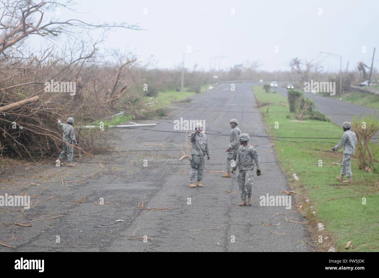Soldiers from the Virgin Islands National Guard clear the Melvin Evans ...