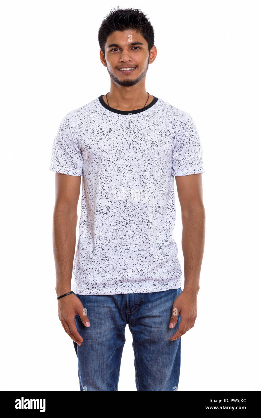 Studio shot of young happy Indian man smiling and standing Stock Photo ...
