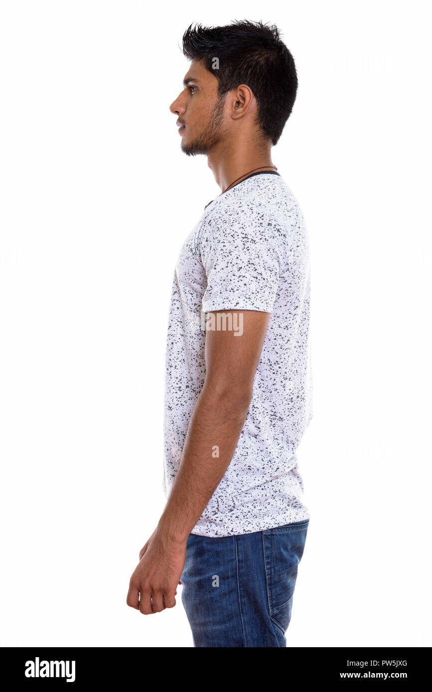 Profile view of young handsome Indian man standing Stock Photo - Alamy