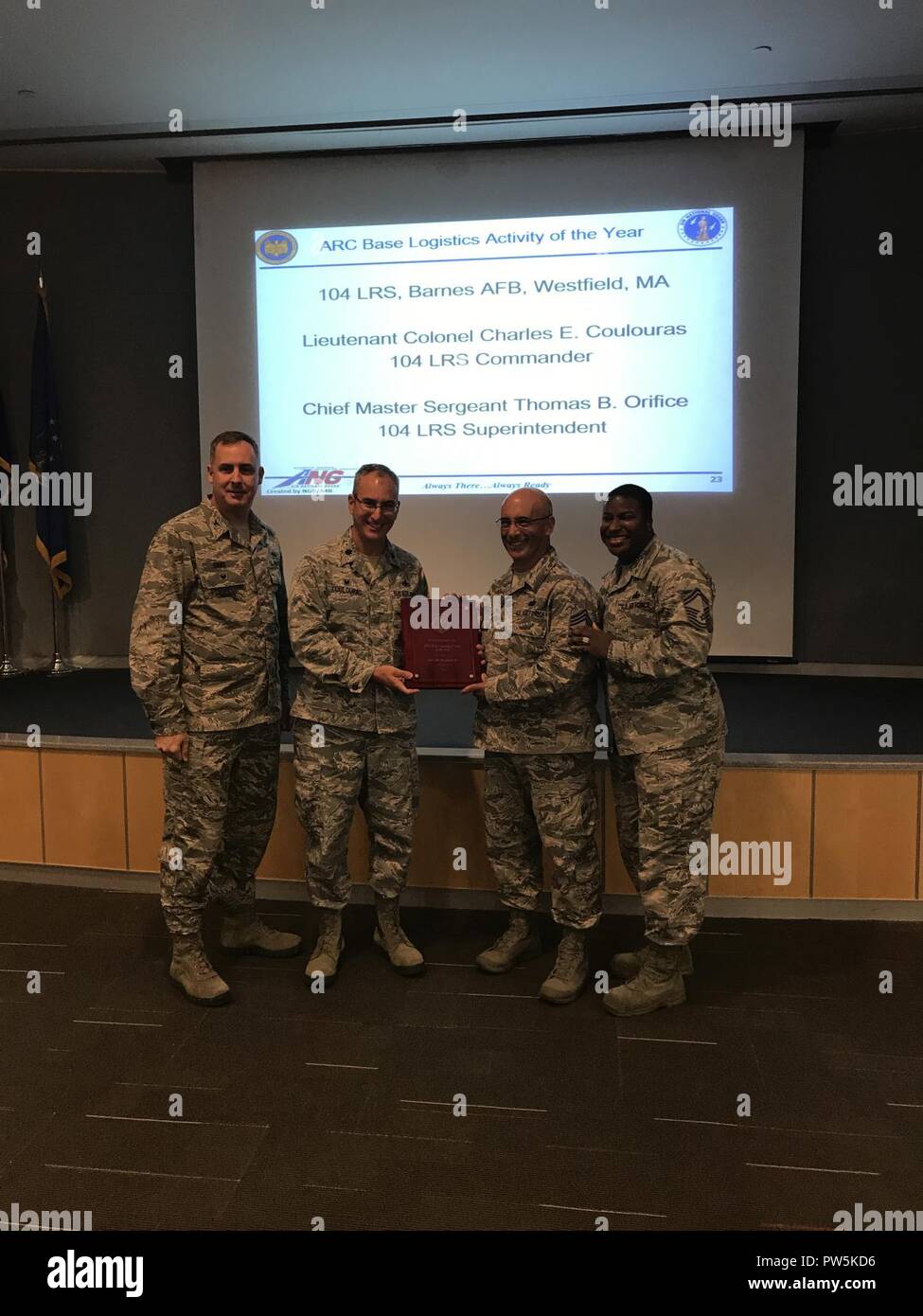 Lt. Col. Charles Coulouras and Chief Master Sgt. Thomas Orifice accept ...
