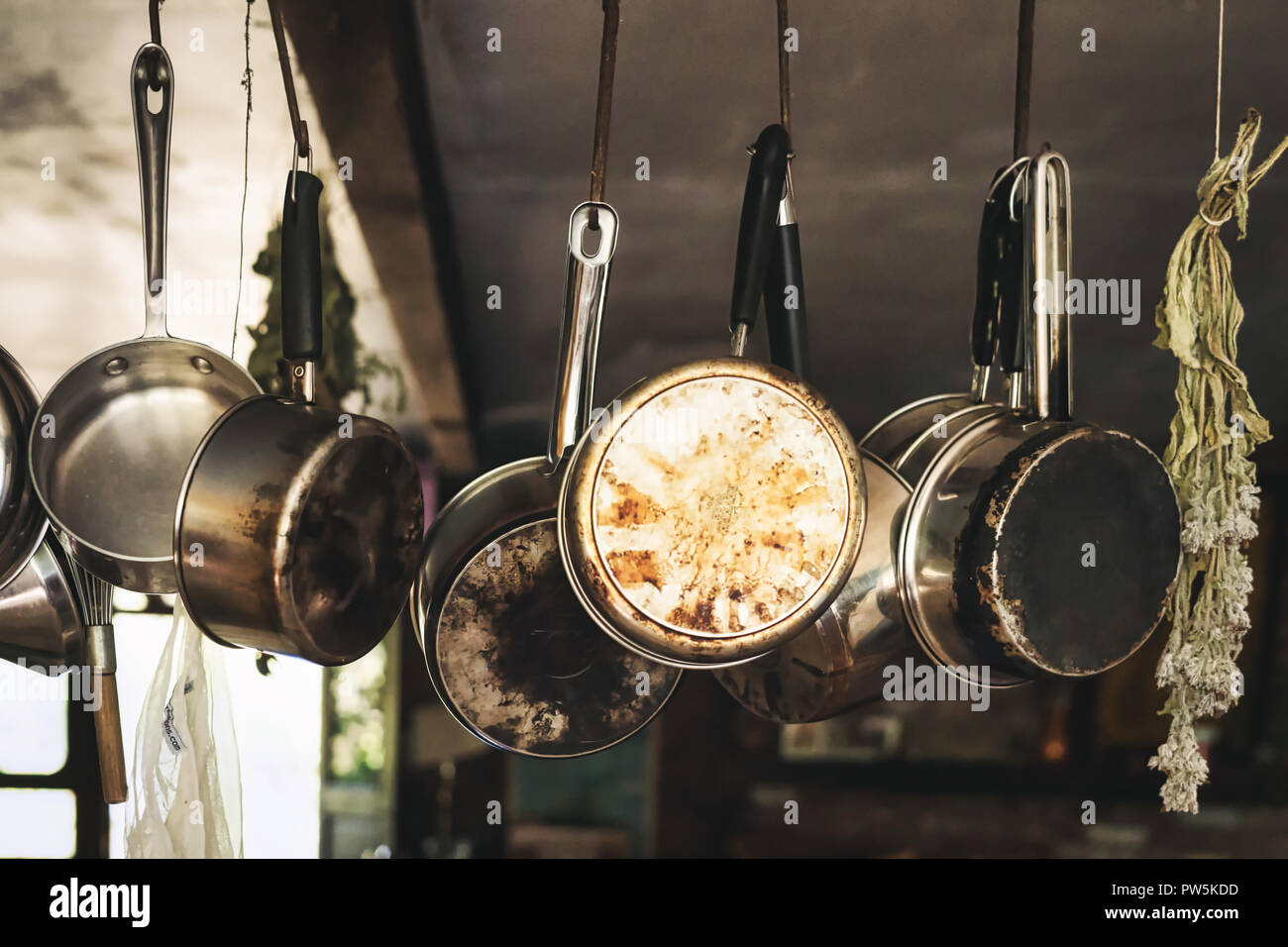 Hanging pans in kitchen hi-res stock photography and images - Alamy