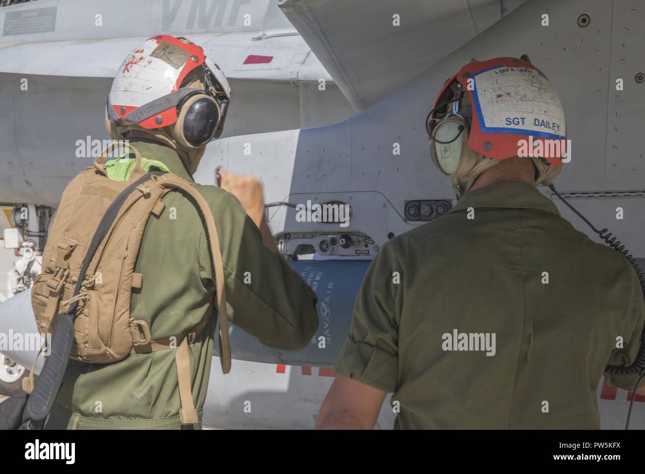U.S. Marine Corps Sgt. Patrick Opp, left, an Aircraft Ordnance ...