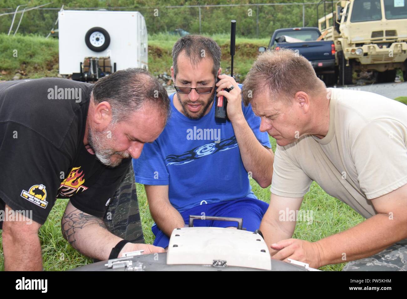 Civilian communications contractors Rick Funk, left, and James Volz ...