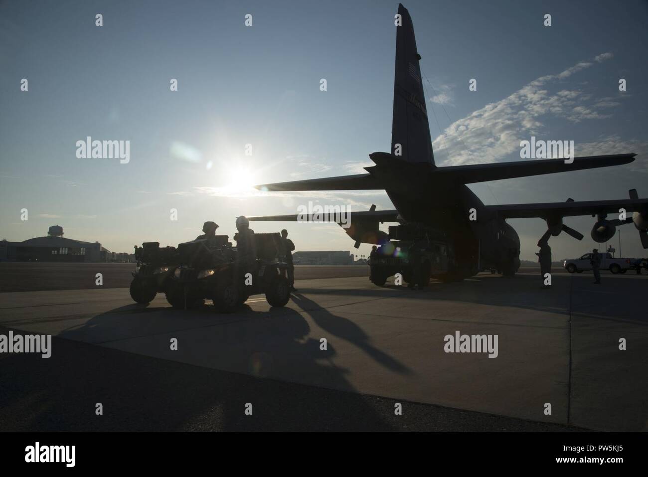 U.S. Air Force Airmen from the 120th Airlift Wing load a C-130 Hercules ...