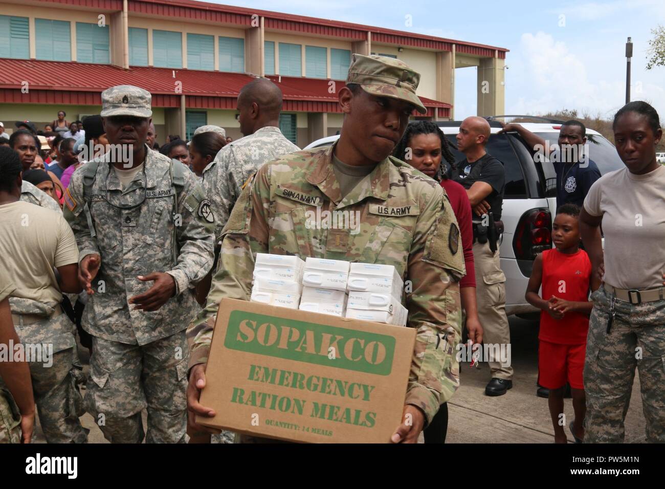 2nd Lt. Mark Sinanan, signal officer, Joint Force Headquarters, carries ...